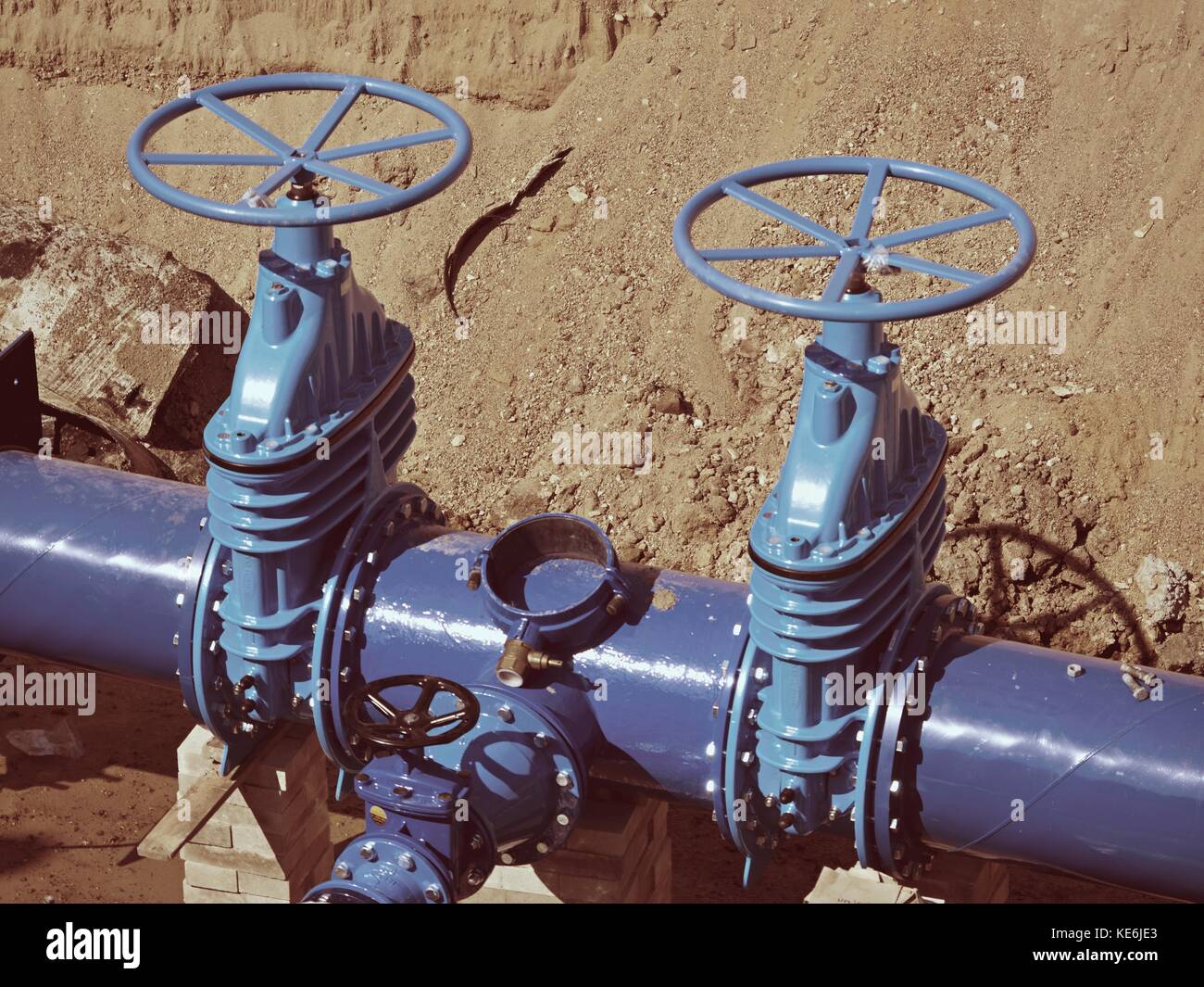 Gate valves underground, water pipeline valve on a blue pipeline after ...