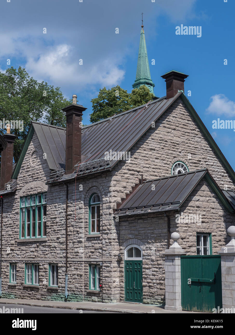 Stone building by Ursuline Chapel with Cathedral of the Holy Trinity ...
