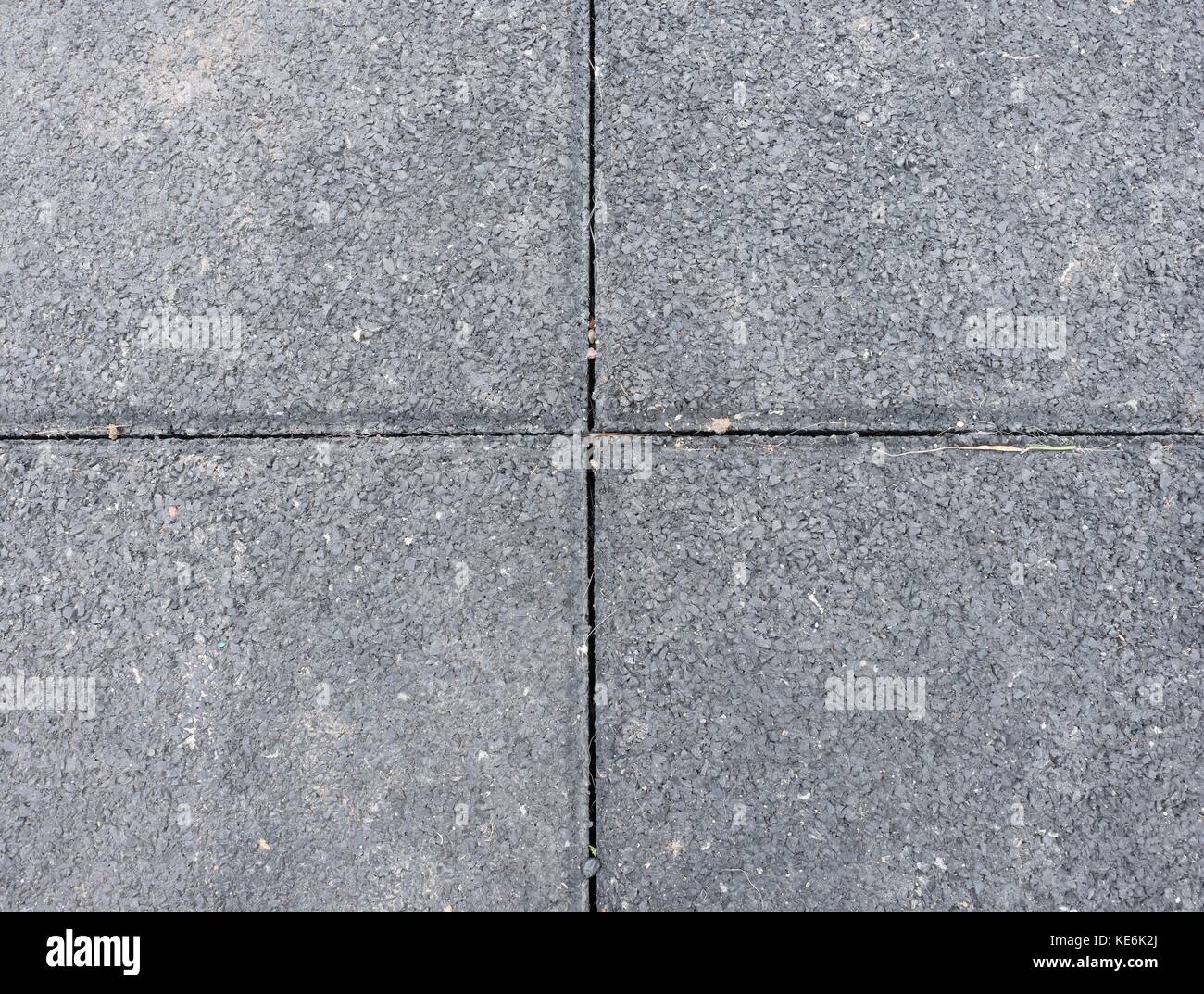 Flexible tile for playground. Tiles made from a mixture of rubber crumb ...