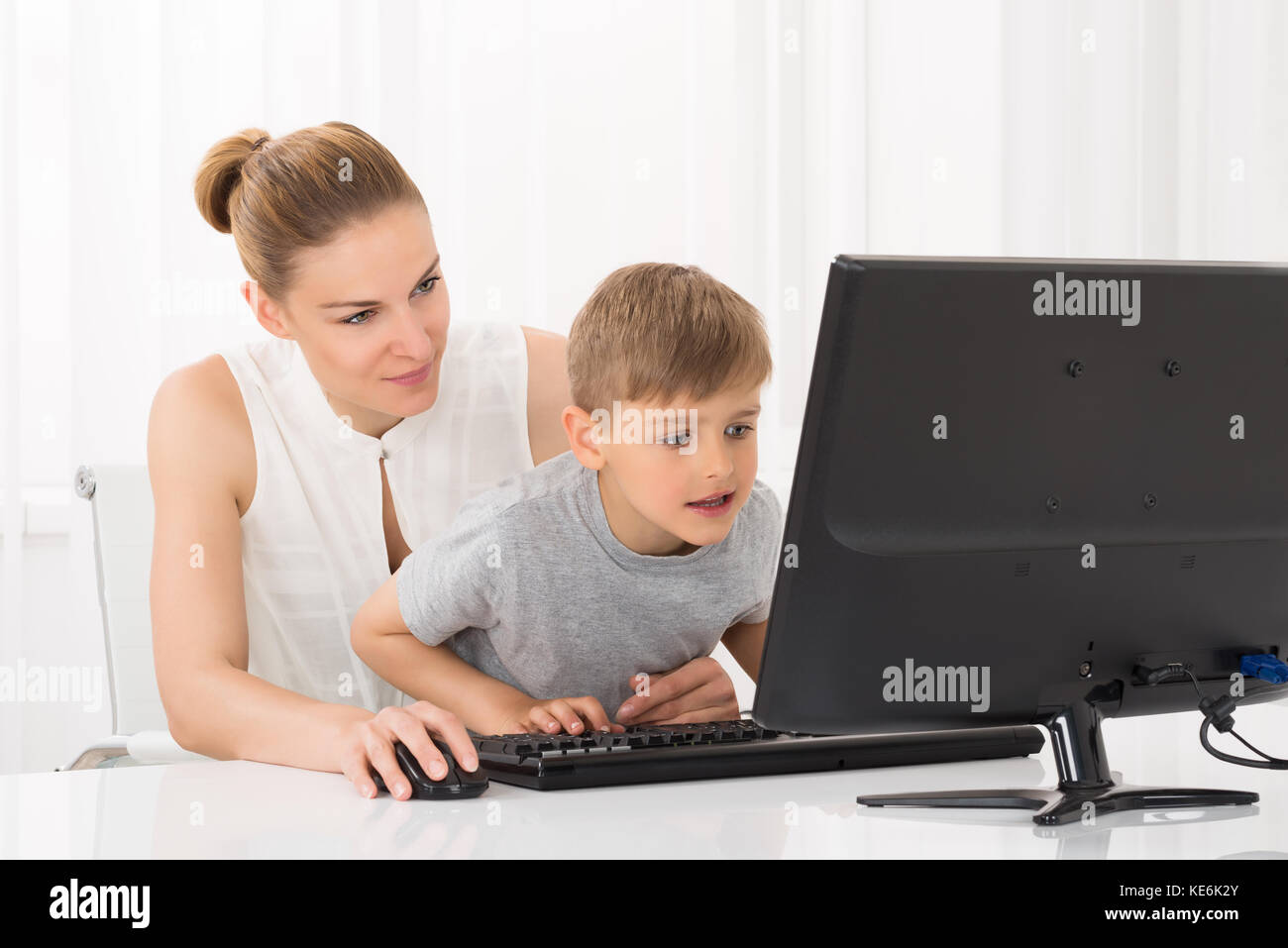Children using computer at home hi-res stock photography and images - Alamy