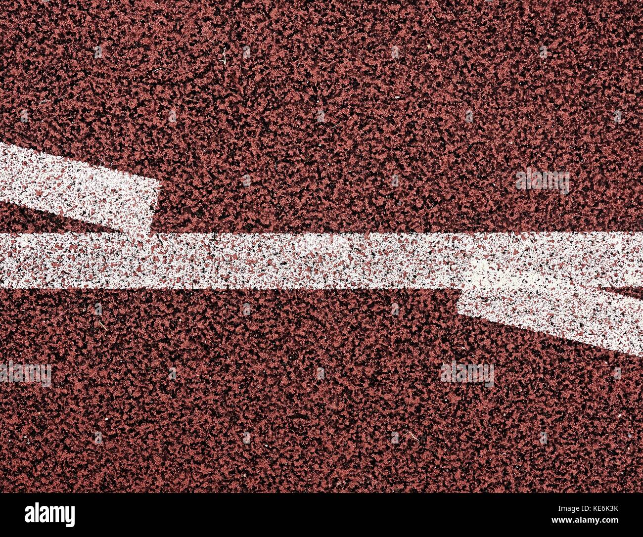 White lines and texture of running racetrack, red rubber racetracks in ...