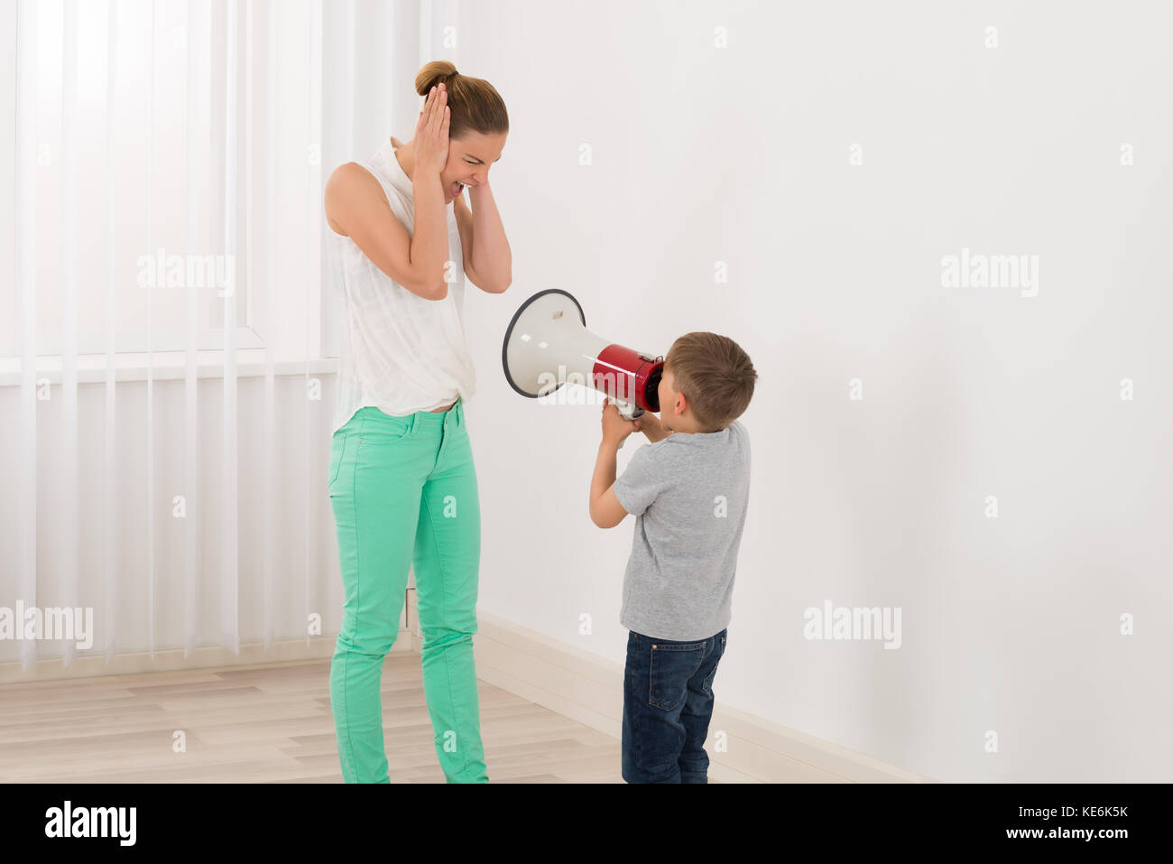 Boy Shouting At Her Mother Through Megaphone Stock Photo - Alamy