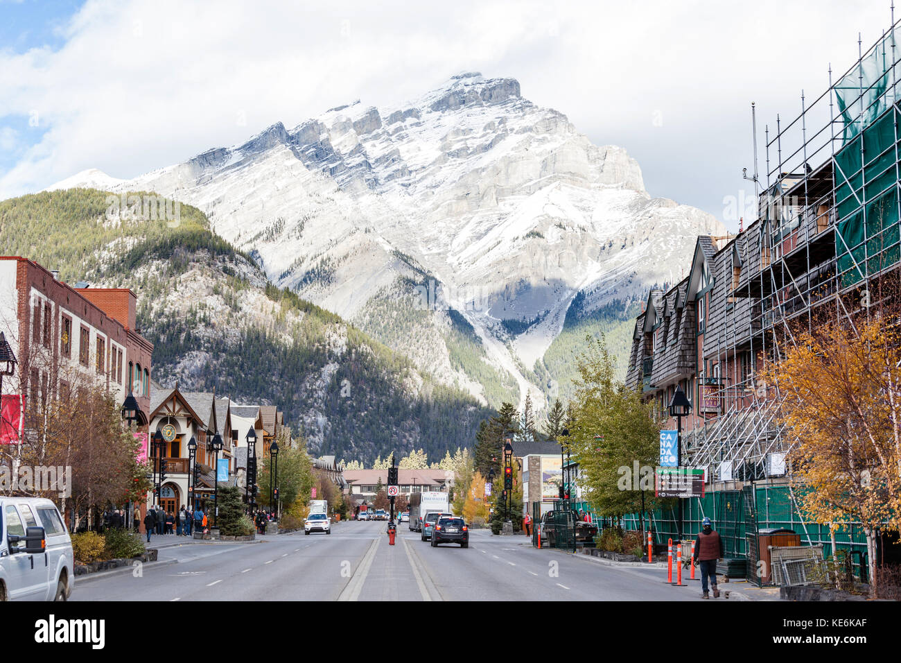 BANFF, CANADA - OCT 16, 2017: Busy Banff Avenue in the Banff National Park with Cascade Mountain ...