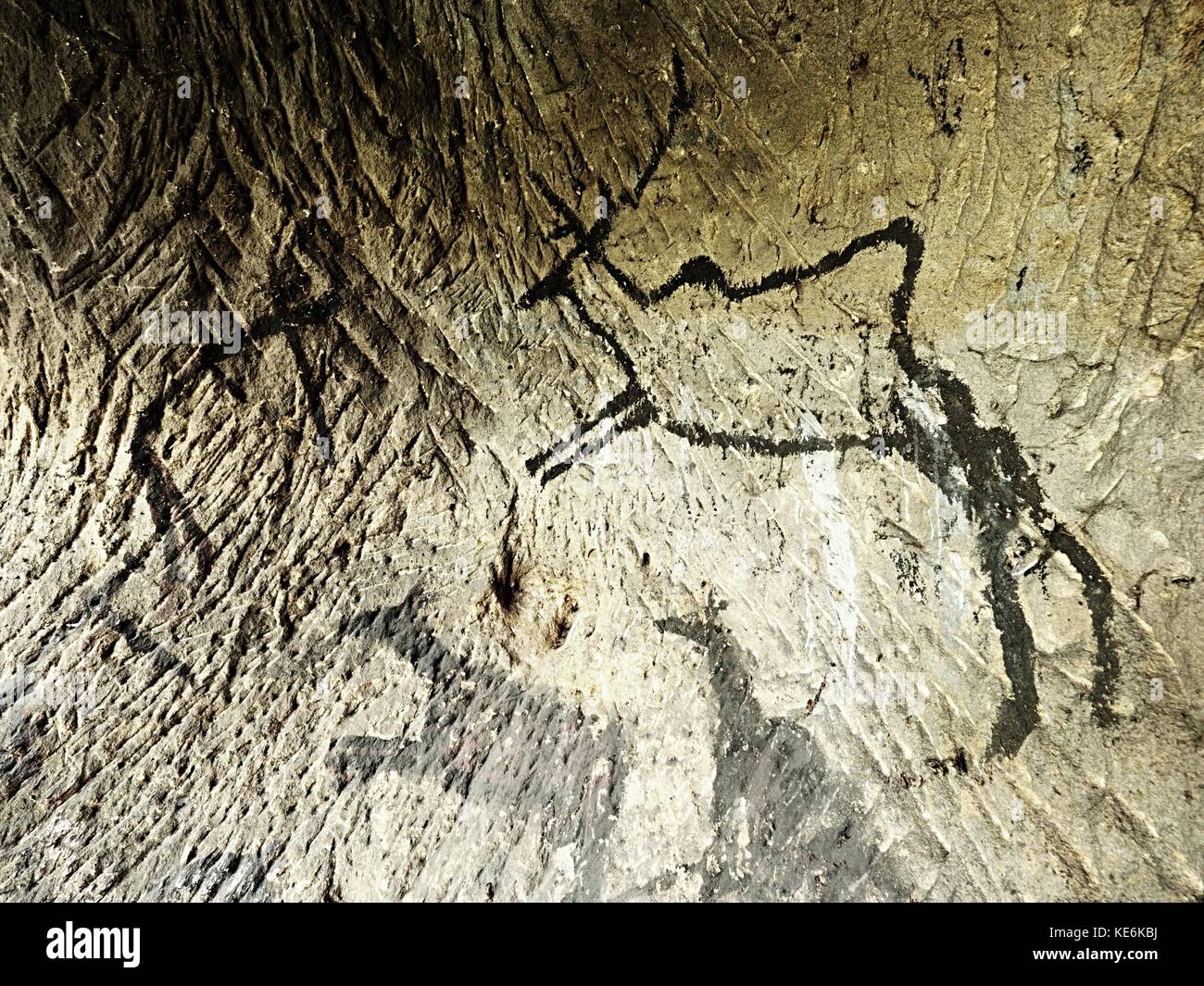 Caveman symbols on sandstone wall. Paint of human hunting, prehistoric ...