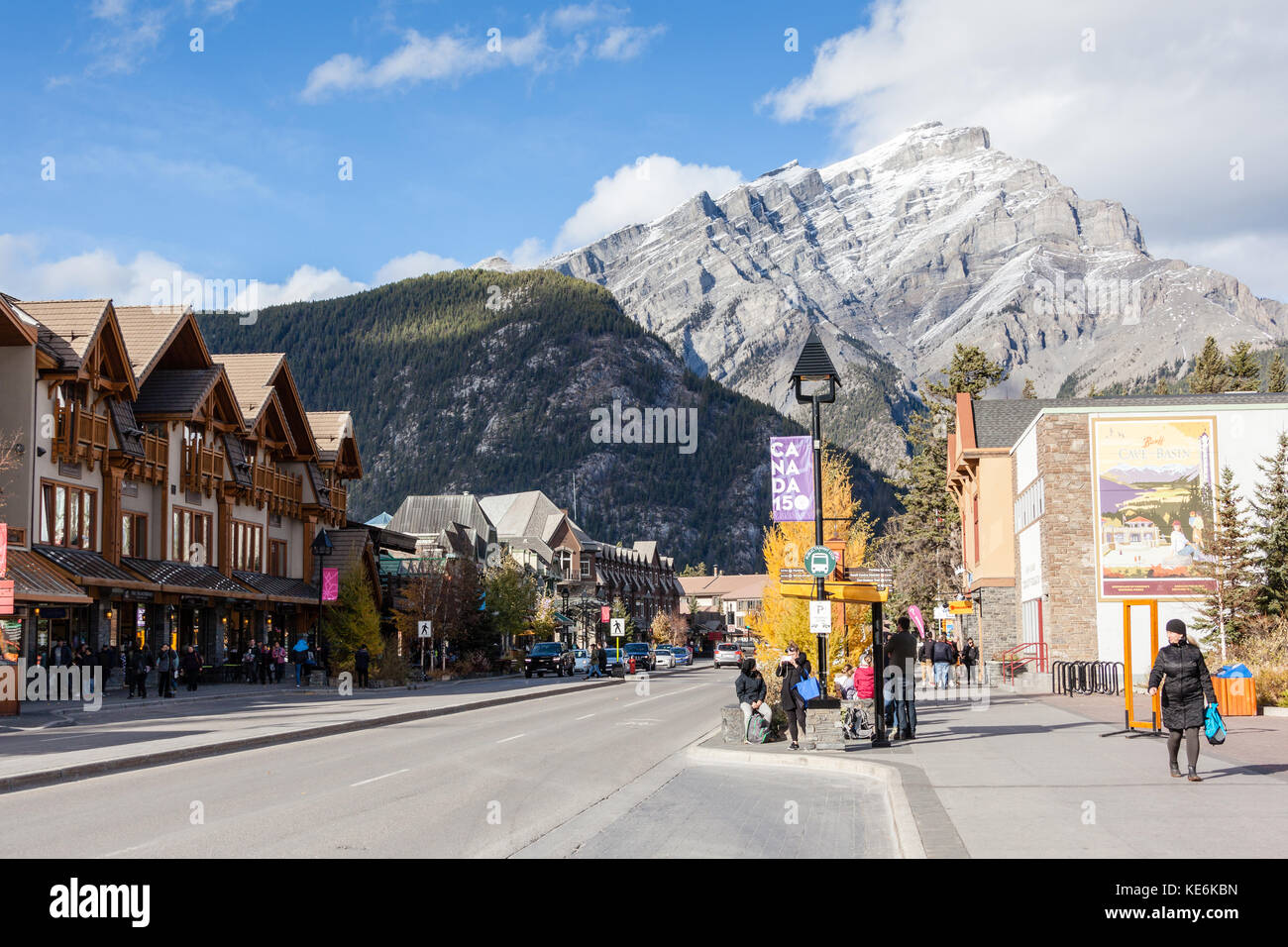 BANFF, CANADA - OCT 16, 2017: Busy Banff Avenue in the Banff National Park with Cascade Mountain ...