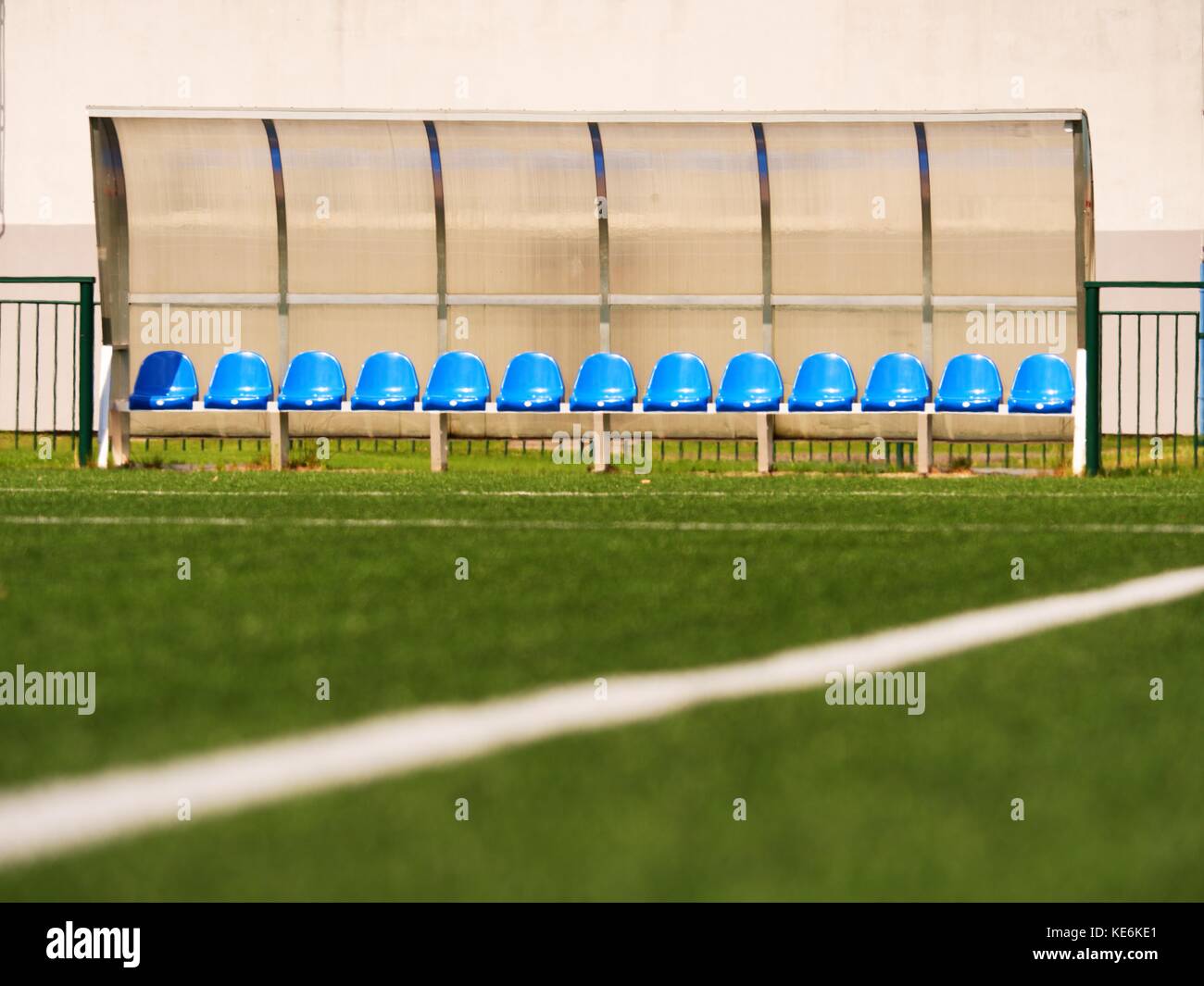 New blue plastic seats on outdoor stadium players bench, chairs with ...
