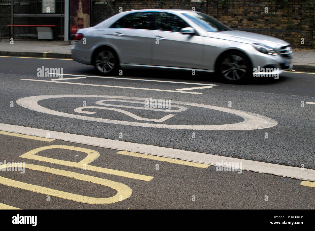 Silver Mercedes-Benz car travels along a road in a suburban 20 mph zone ...