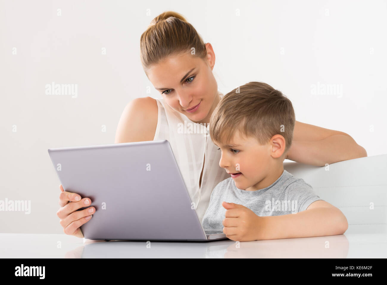 Close-up Of Mother And Son Using Laptop Stock Photo - Alamy