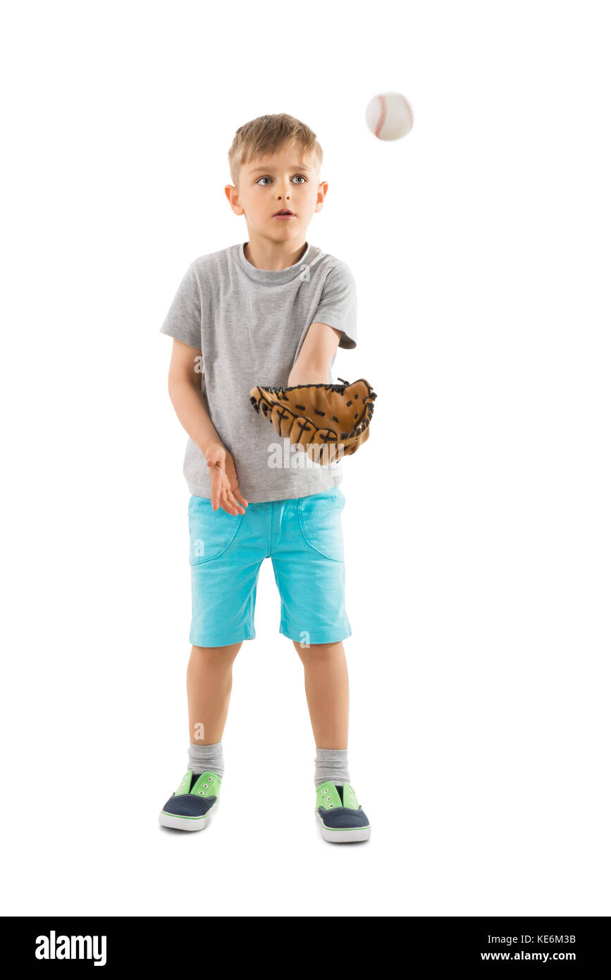 Cute Little Boy Trying To Catch Baseball In His Glove Over White ...