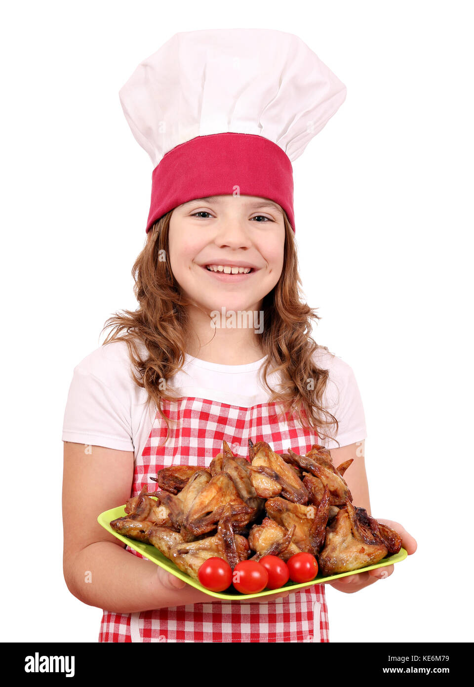 happy little girl cook with chicken wings Stock Photo - Alamy