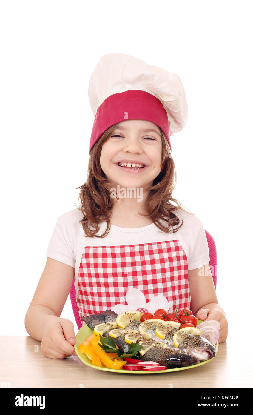 happy little girl cook with trout fish Stock Photo - Alamy
