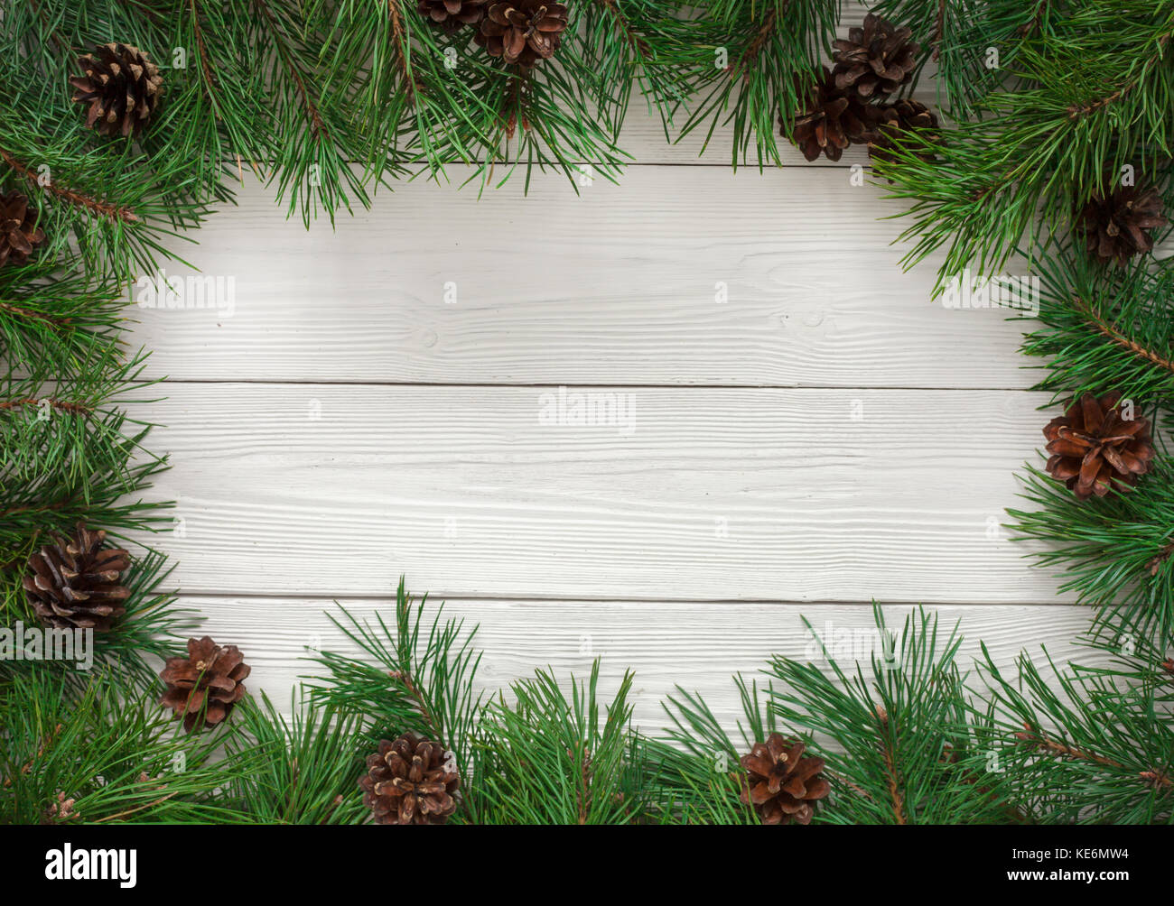 Template for Christmas card with fir tree border and copy space. Wooden ...