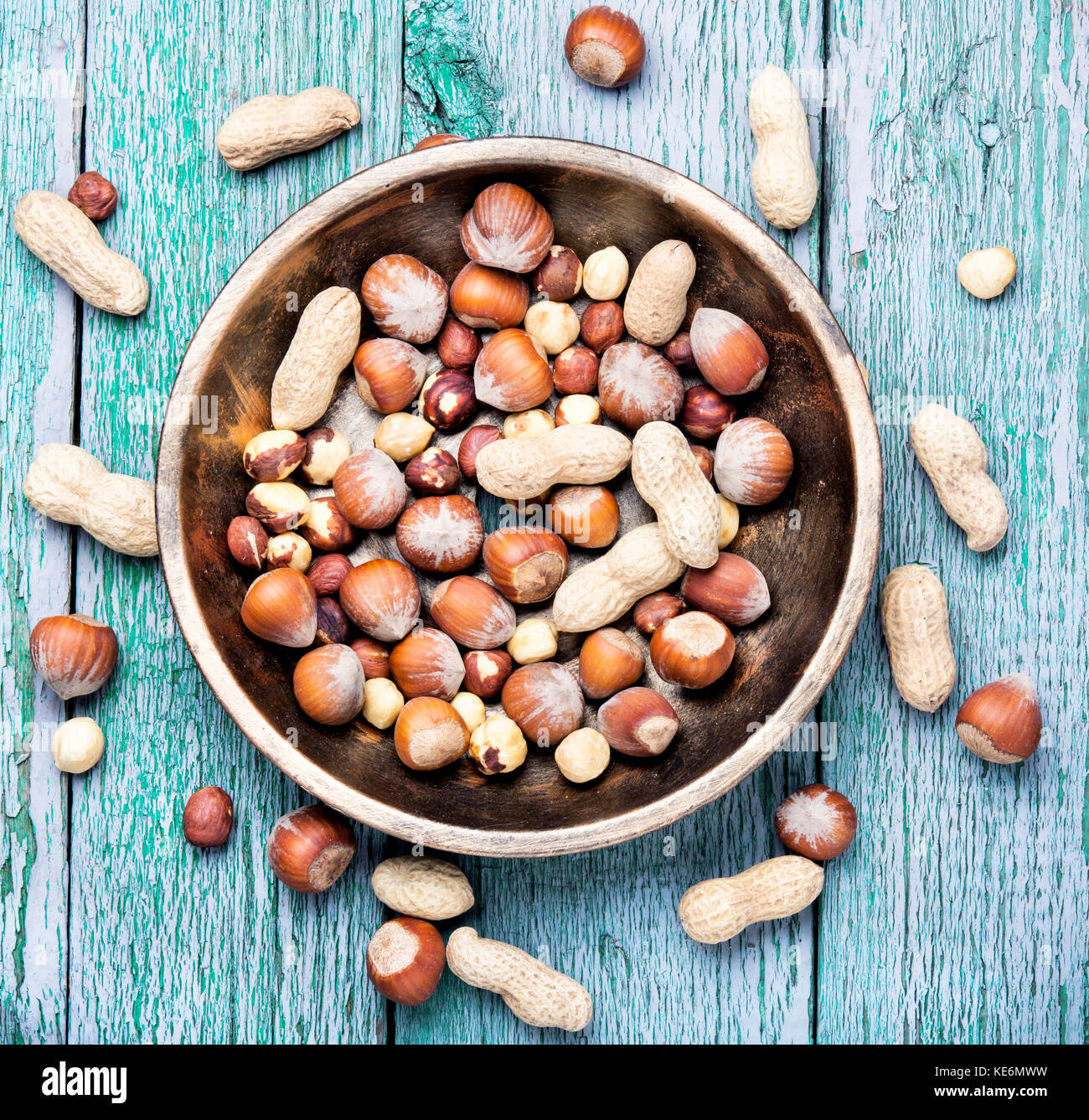 nut peanuts,hazelnuts in the shell and chipped in a bowl Stock Photo ...