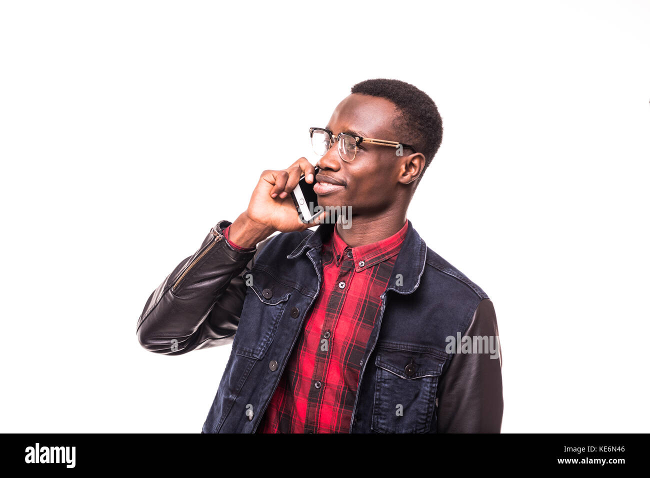 Young African American man making a phone call on her smartphone ...