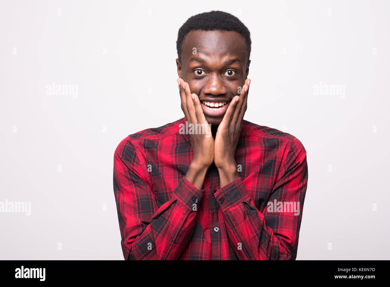 Omg. Half profile shot of pop-eyed funny young black man looking ahead ...
