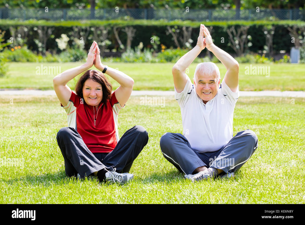Mature couple practising yoga hi-res stock photography and images - Alamy