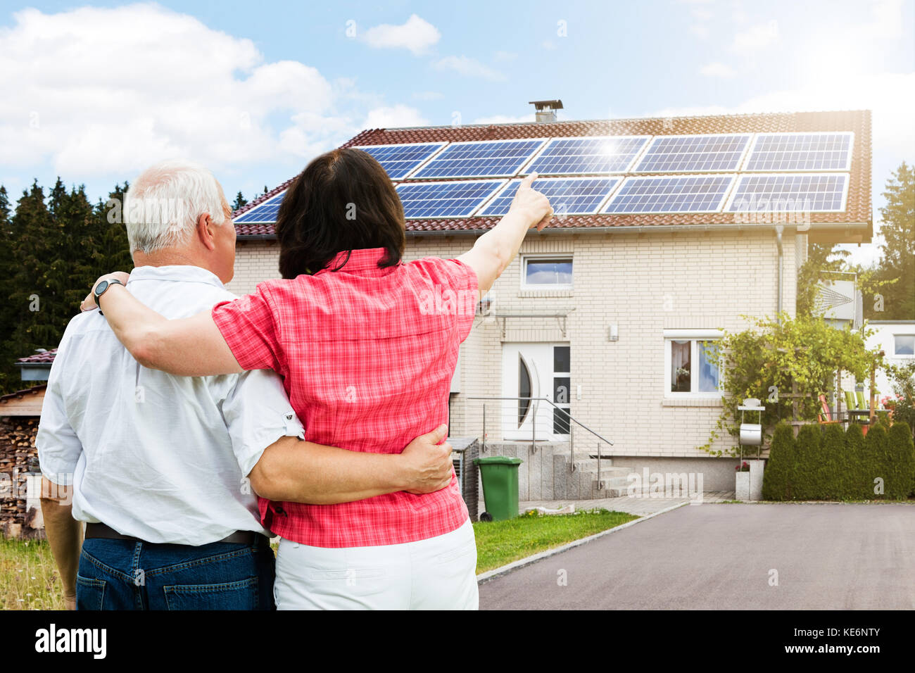Rear View Of Senior Couple Pointing Finger In Front Of House Stock ...