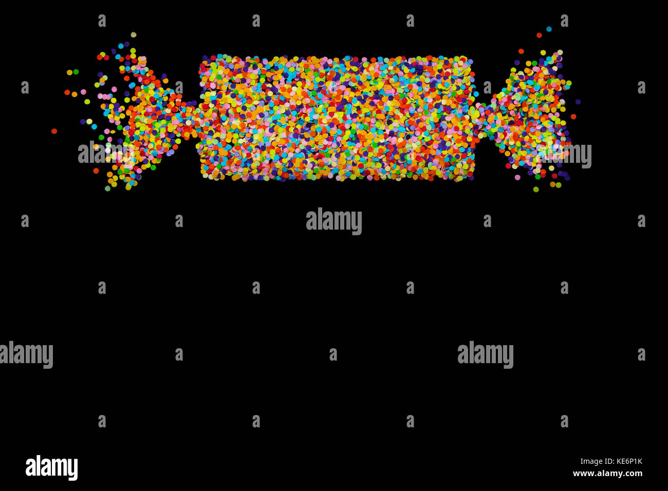 Candy, cracker of a festive colored confetti. Black background Stock ...