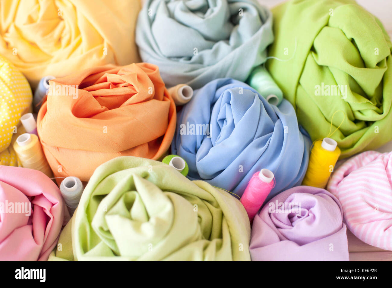 Colored fabric folded in the form of rose flowers Stock Photo - Alamy