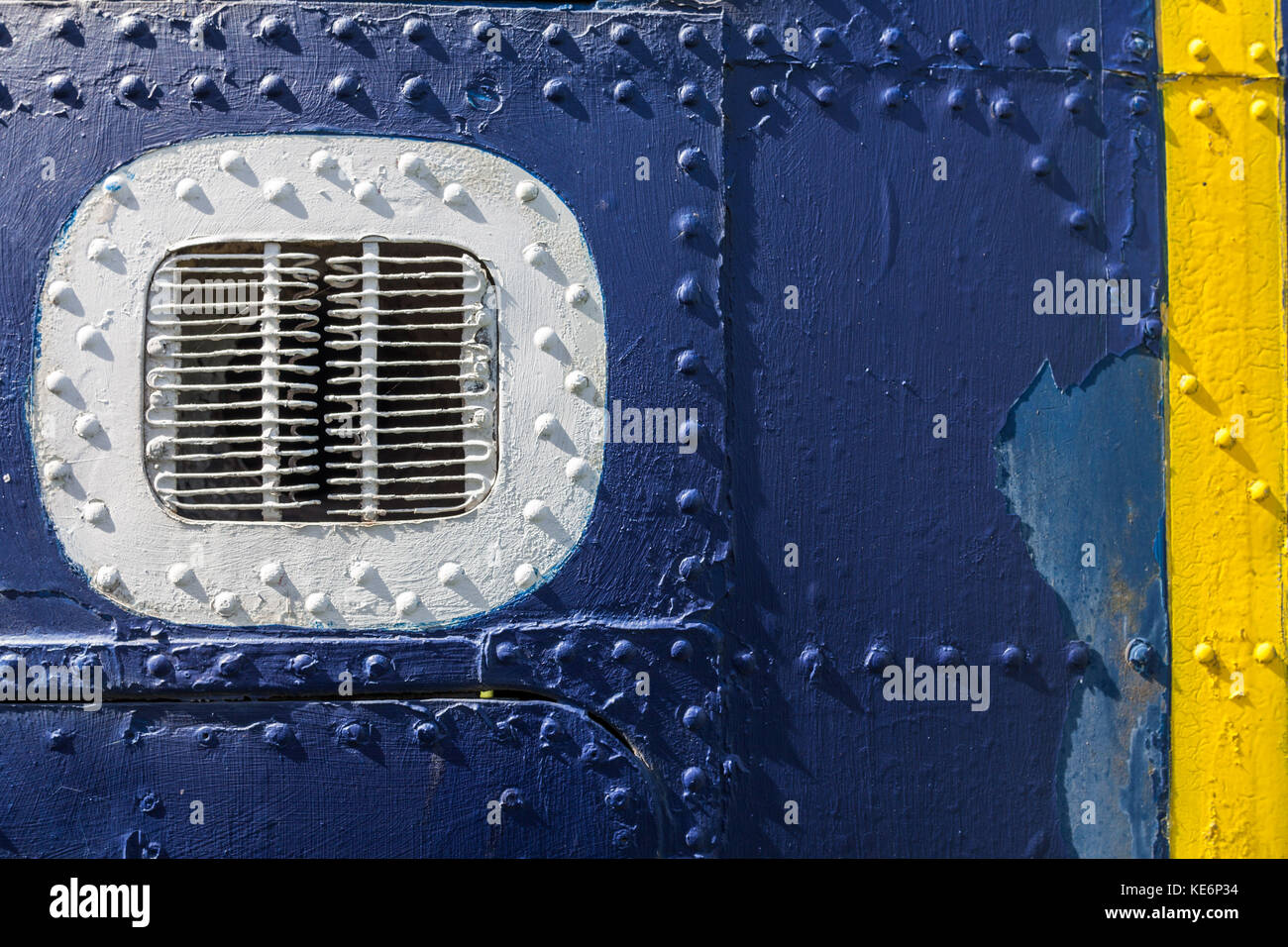 Texture background fragment of an old airplane painted in blue with ...