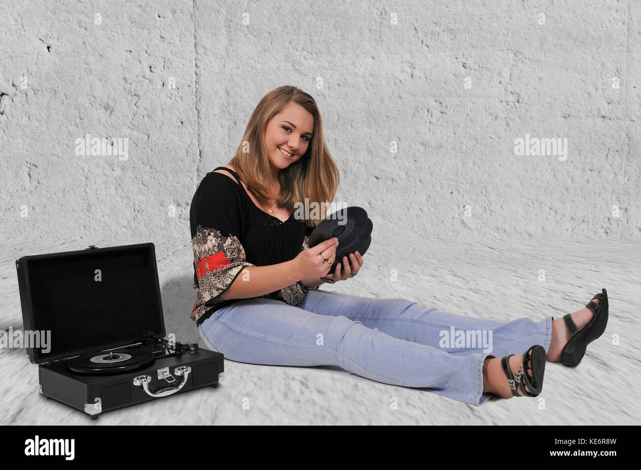 Beautiful woman with vintage 45 single record Stock Photo - Alamy