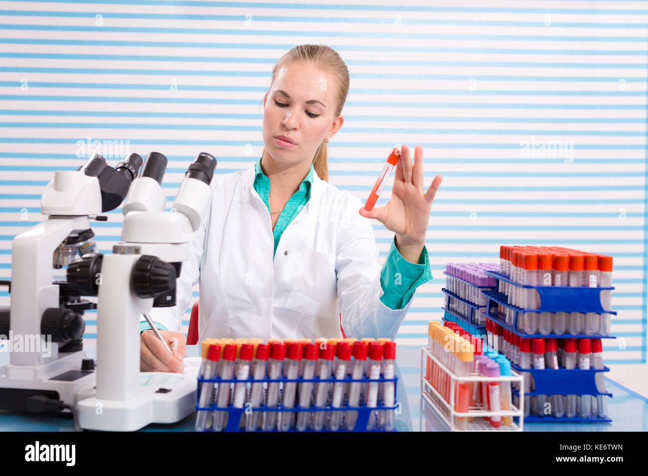 A nurse in a hospital laboratory tests a blood Stock Photo - Alamy