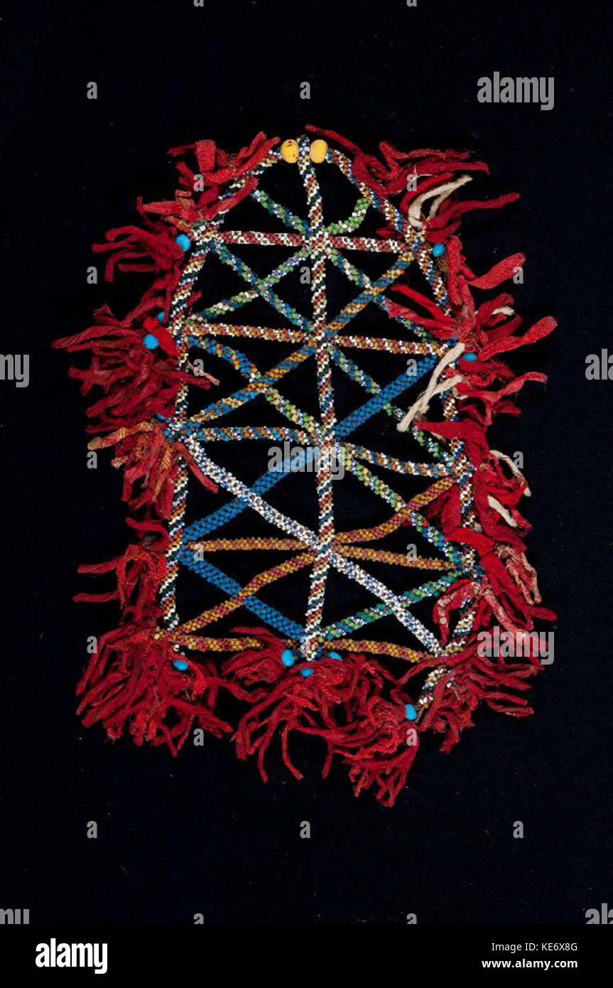 Apron made of beadwork and red cotton rags, worn by women during ...