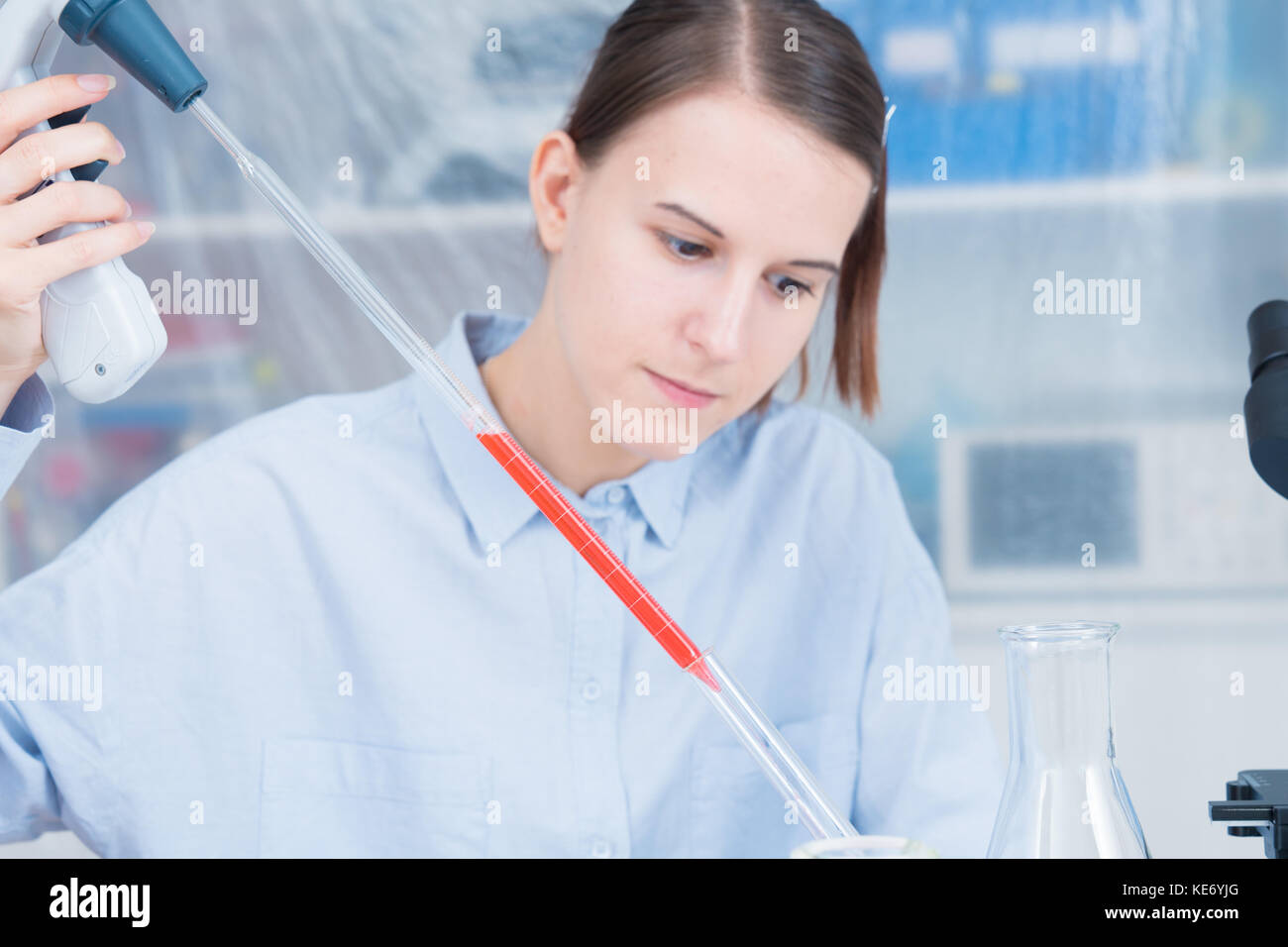 Woman Scientist Adding Liquid To Test Tube With Pipette In Lab Stock ...