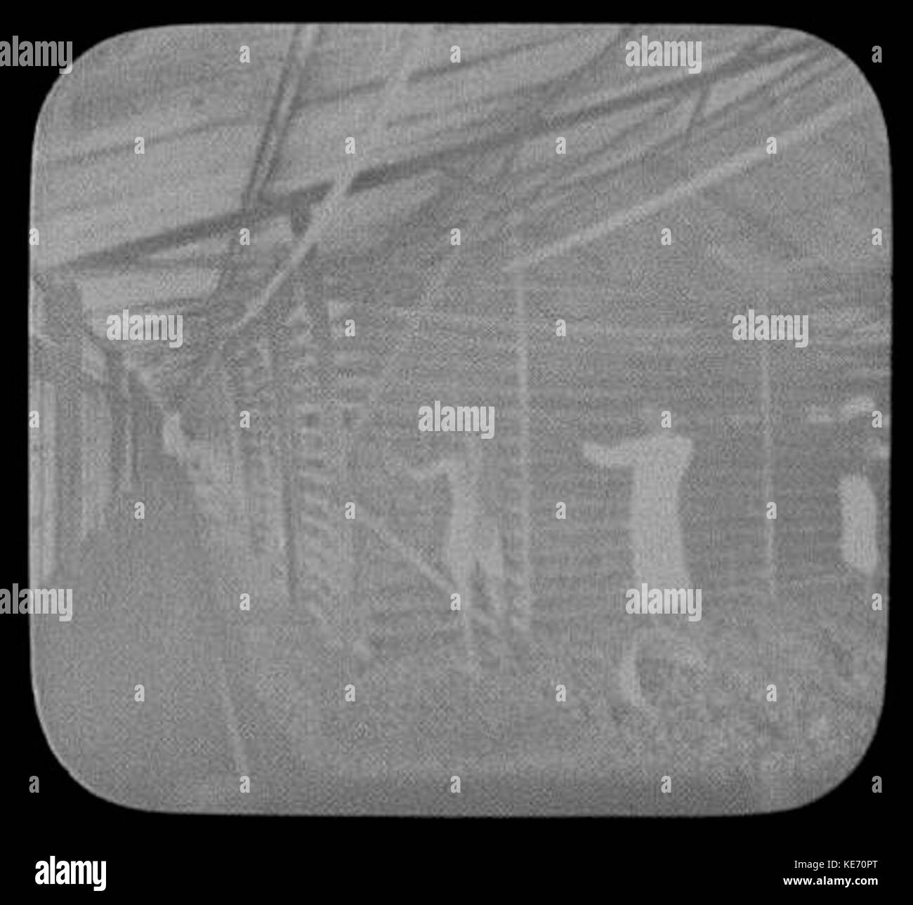 This photograph shows a tea factory with a focus on the withering loft ...