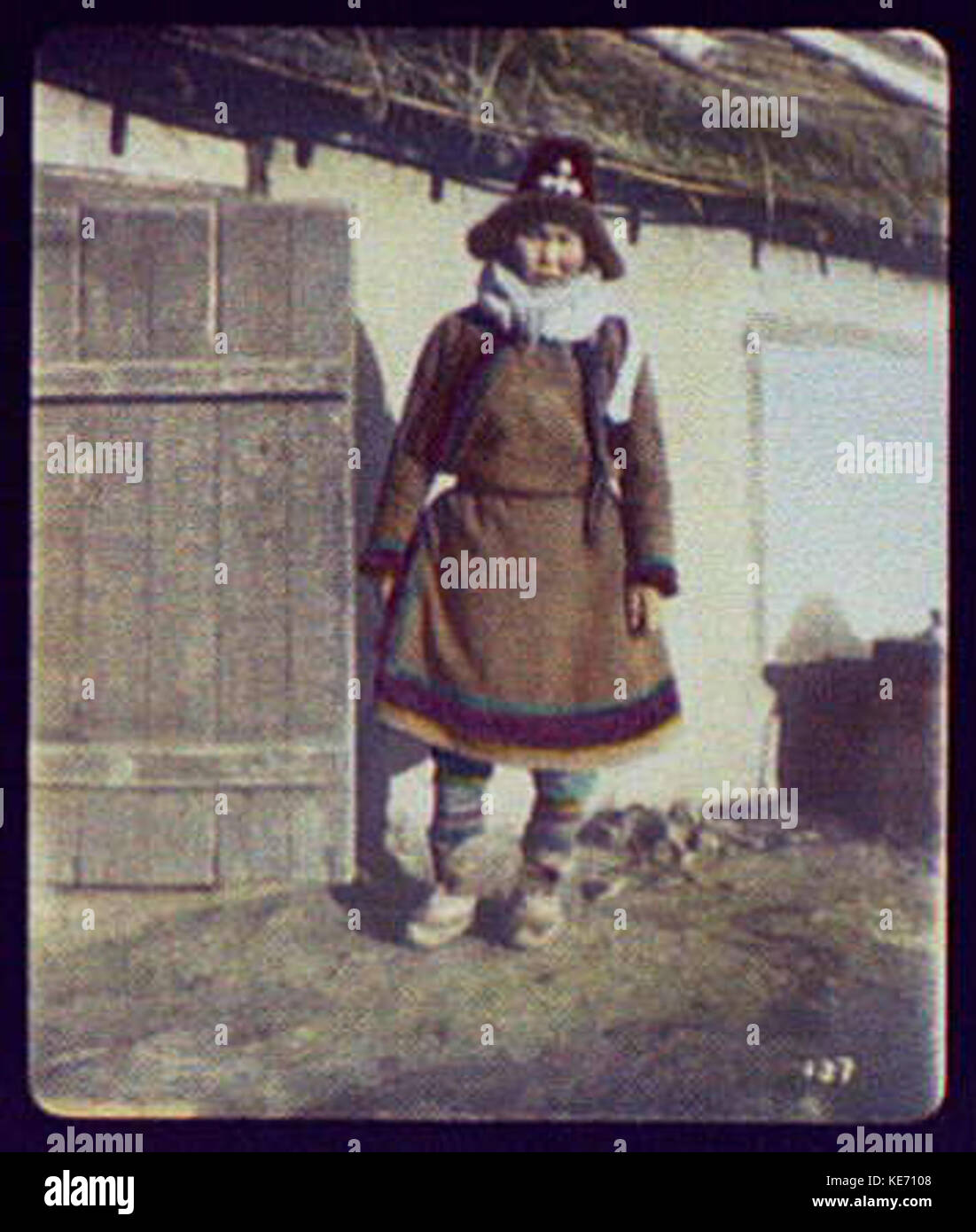 The image depicts the wife of a Goldi village chieftain, showcasing ...