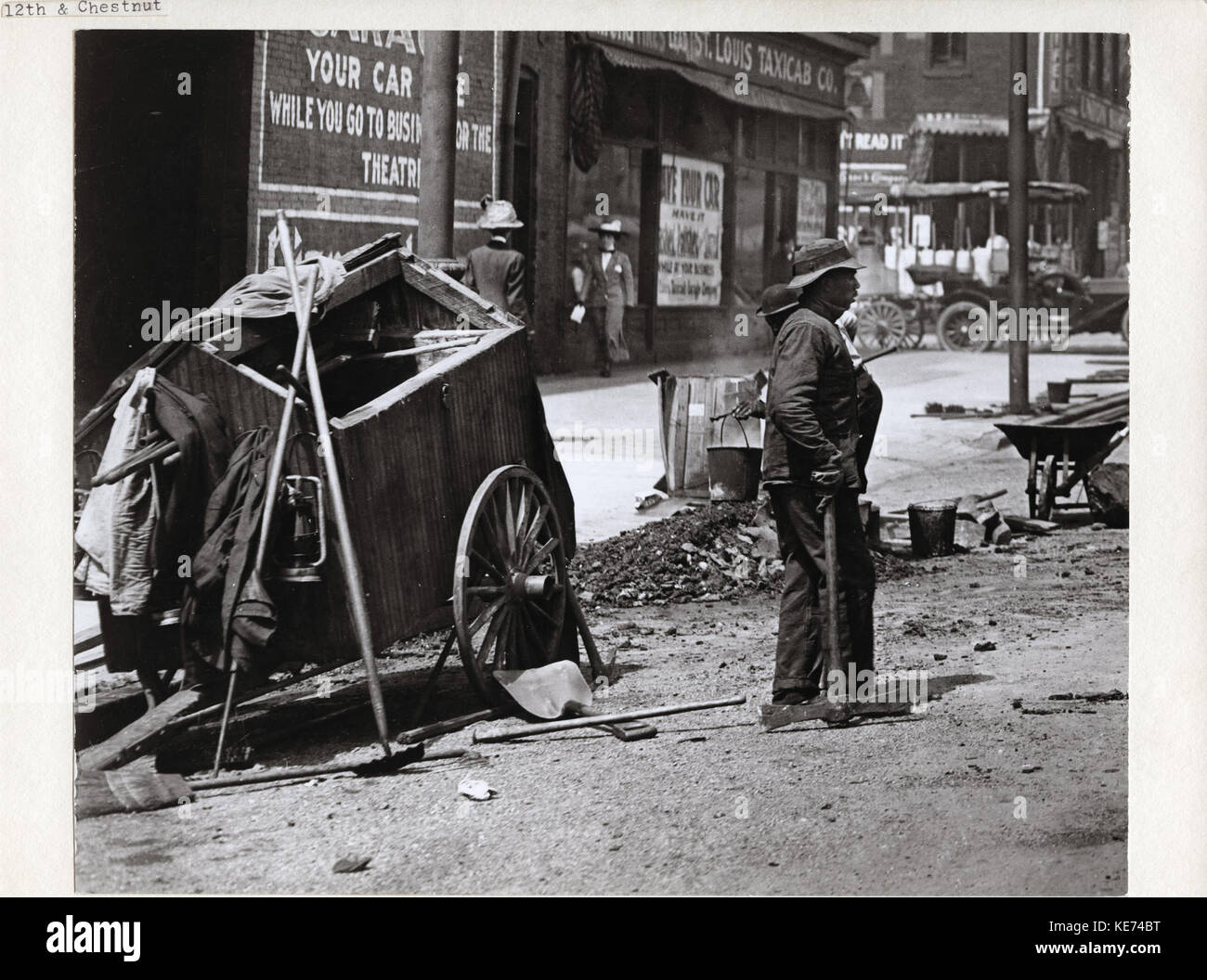 This photograph shows a worker taking a break during street work at the ...
