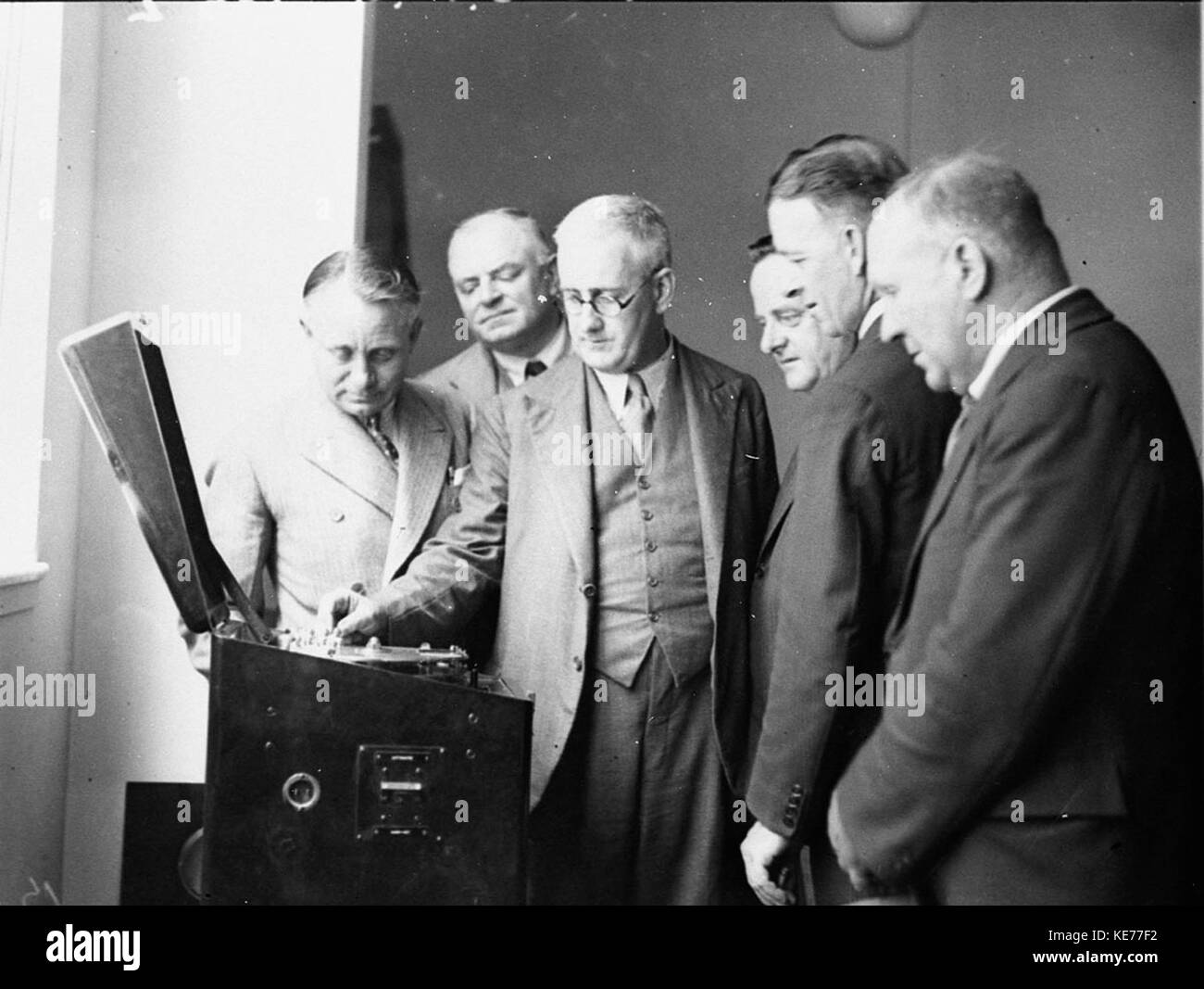43359 AWA marine supt WH Phillip demonstrates the automatic SOS machine ...