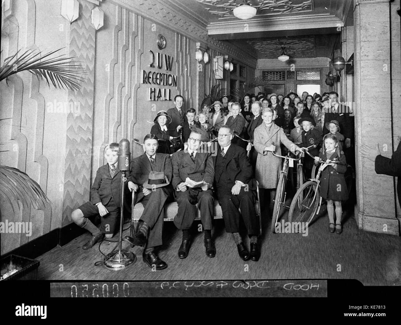 A photograph of children receiving Malvern Star bicycles from champion ...