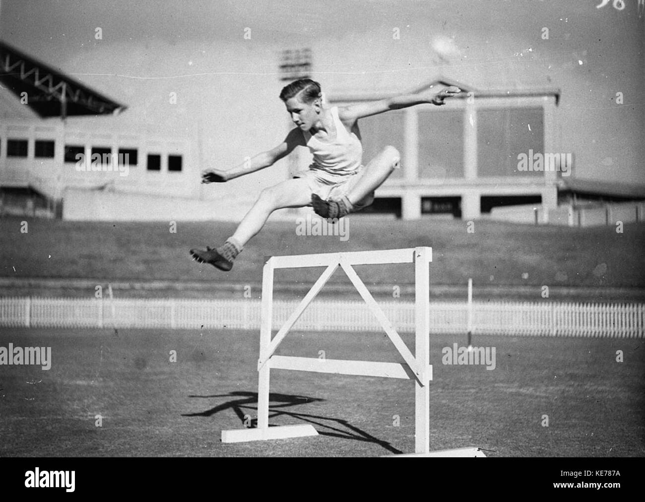 42596 Competitor in the 120 yards hurdles PSAAA Sports Stock Photo - Alamy