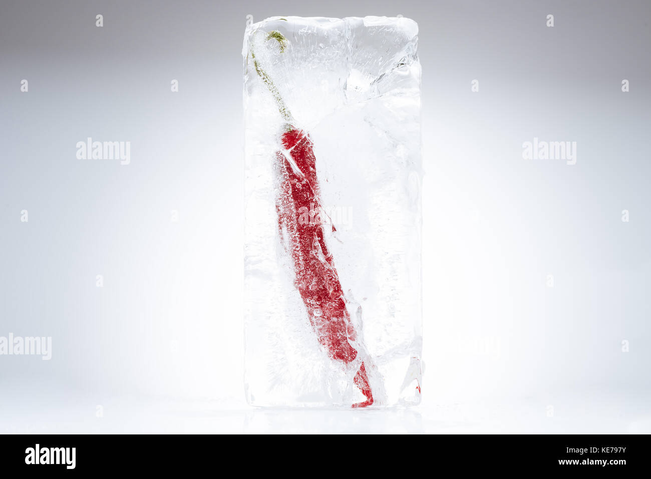 chili pepper in melting ice Stock Photo - Alamy