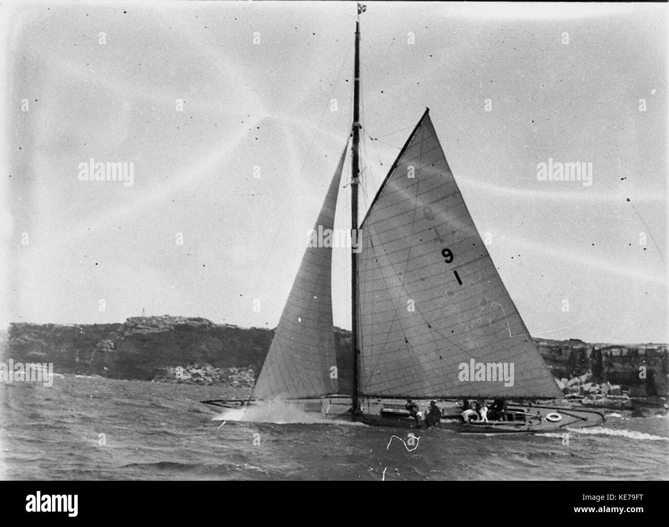 51591 Gaff rigged yacht 91 passing out through the Heads Stock Photo ...