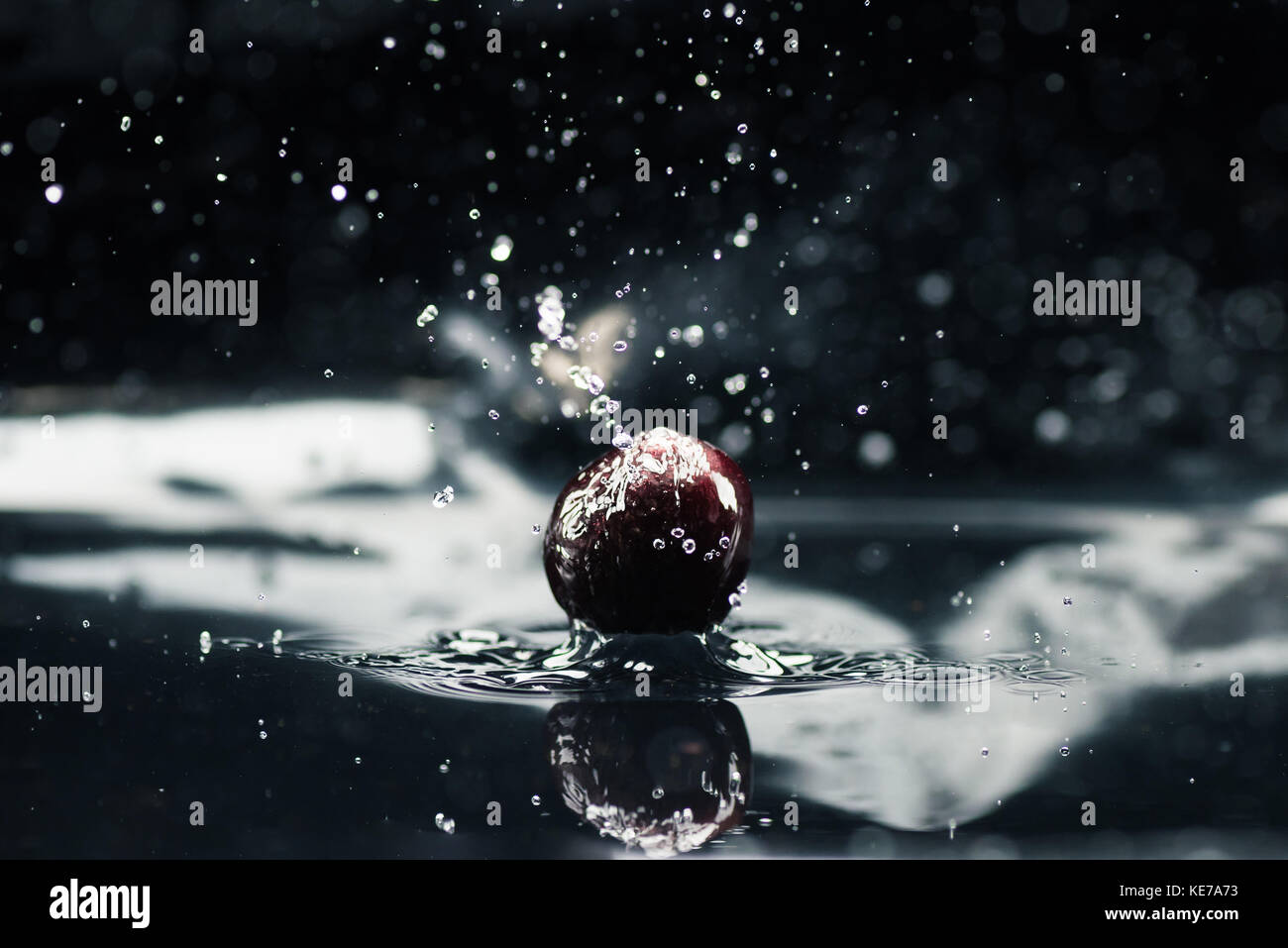 ripe cherry falling in water Stock Photo - Alamy