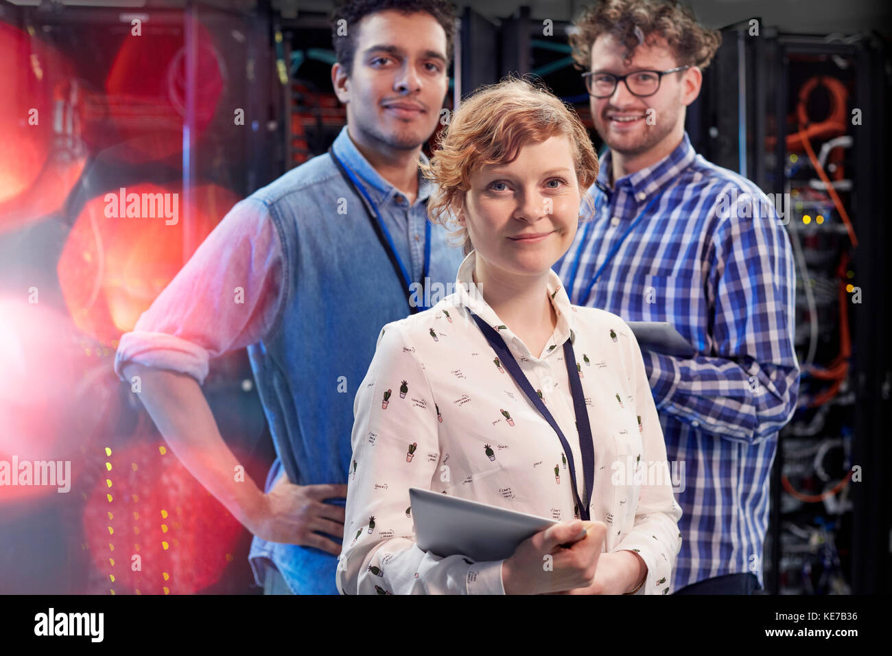 Portrait confident IT technicians with digital tablet in server room ...