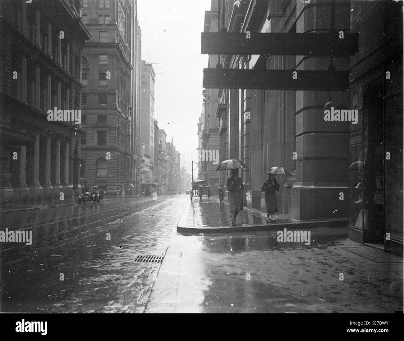 7928 Pitt Street on rainy day Between the GPO Commonwealth Bank Stock ...