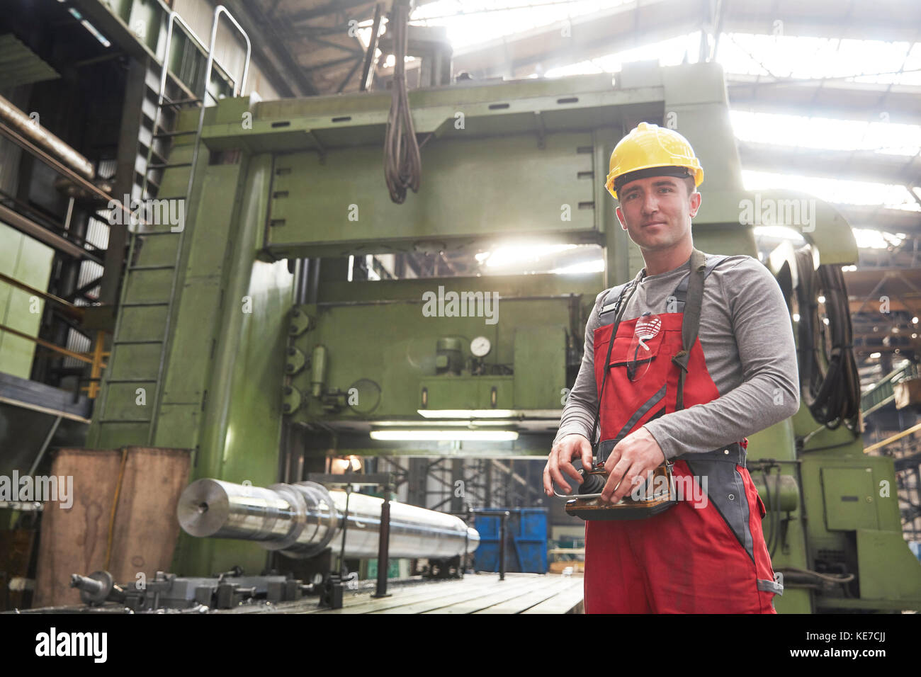 Portrait confident male worker working in steel factory Stock Photo - Alamy