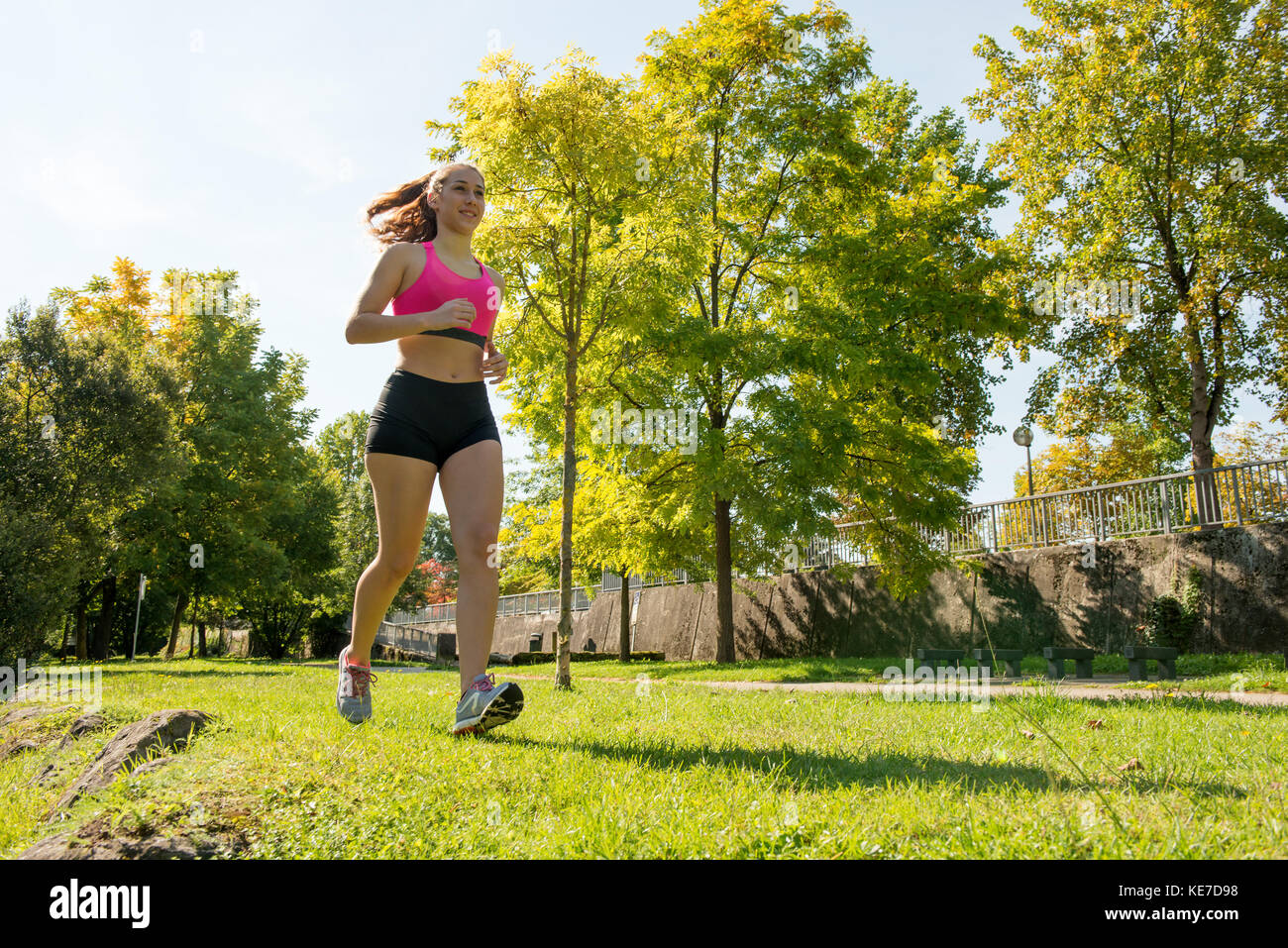 a beautiful young woman running in nature Stock Photo - Alamy