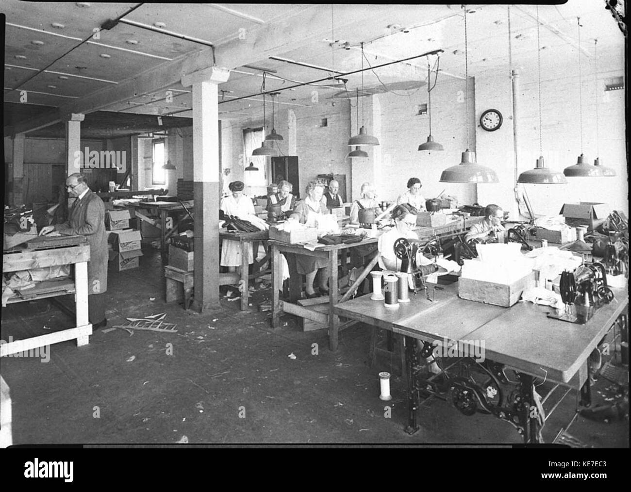 13249 Workers in a clothing factory using power sewing machines Barton ...