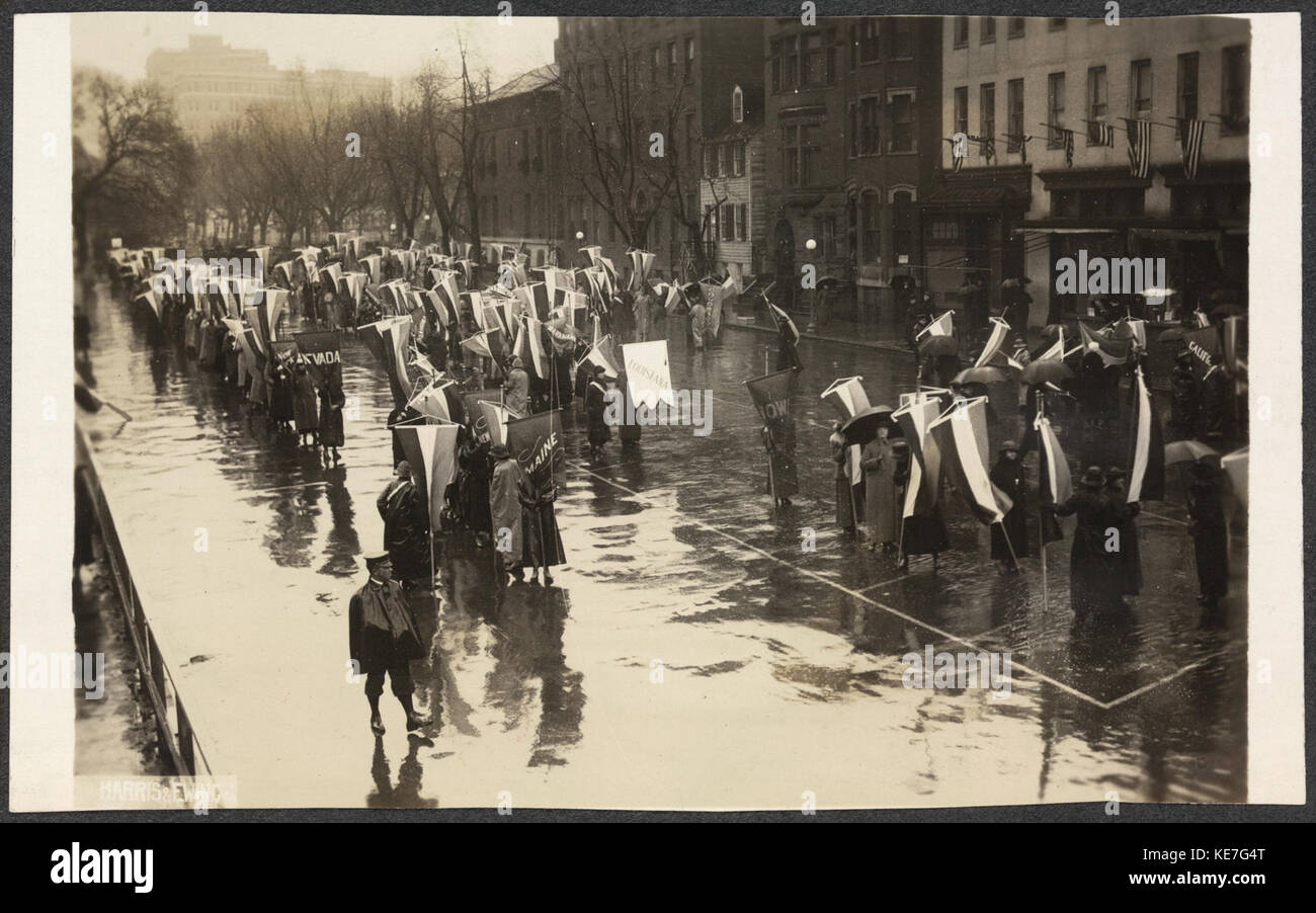 Suffragists marching in rainy street 159043v Stock Photo - Alamy