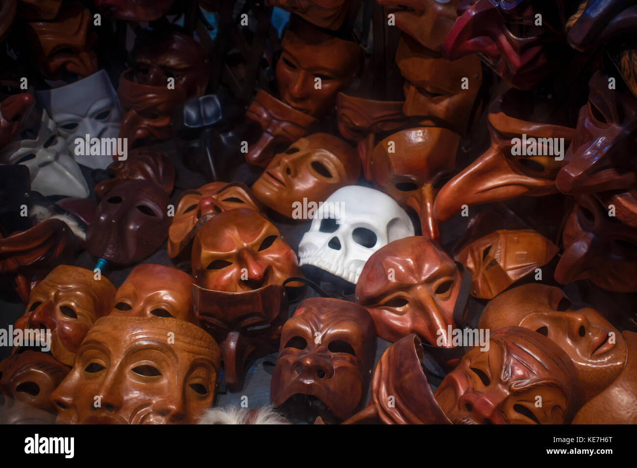 mask in the form of the skull among the many simple masks Stock Photo ...