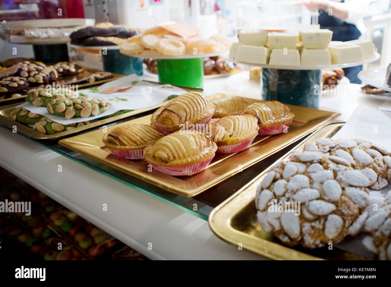 Shop with sweets, view through the window Stock Photo - Alamy