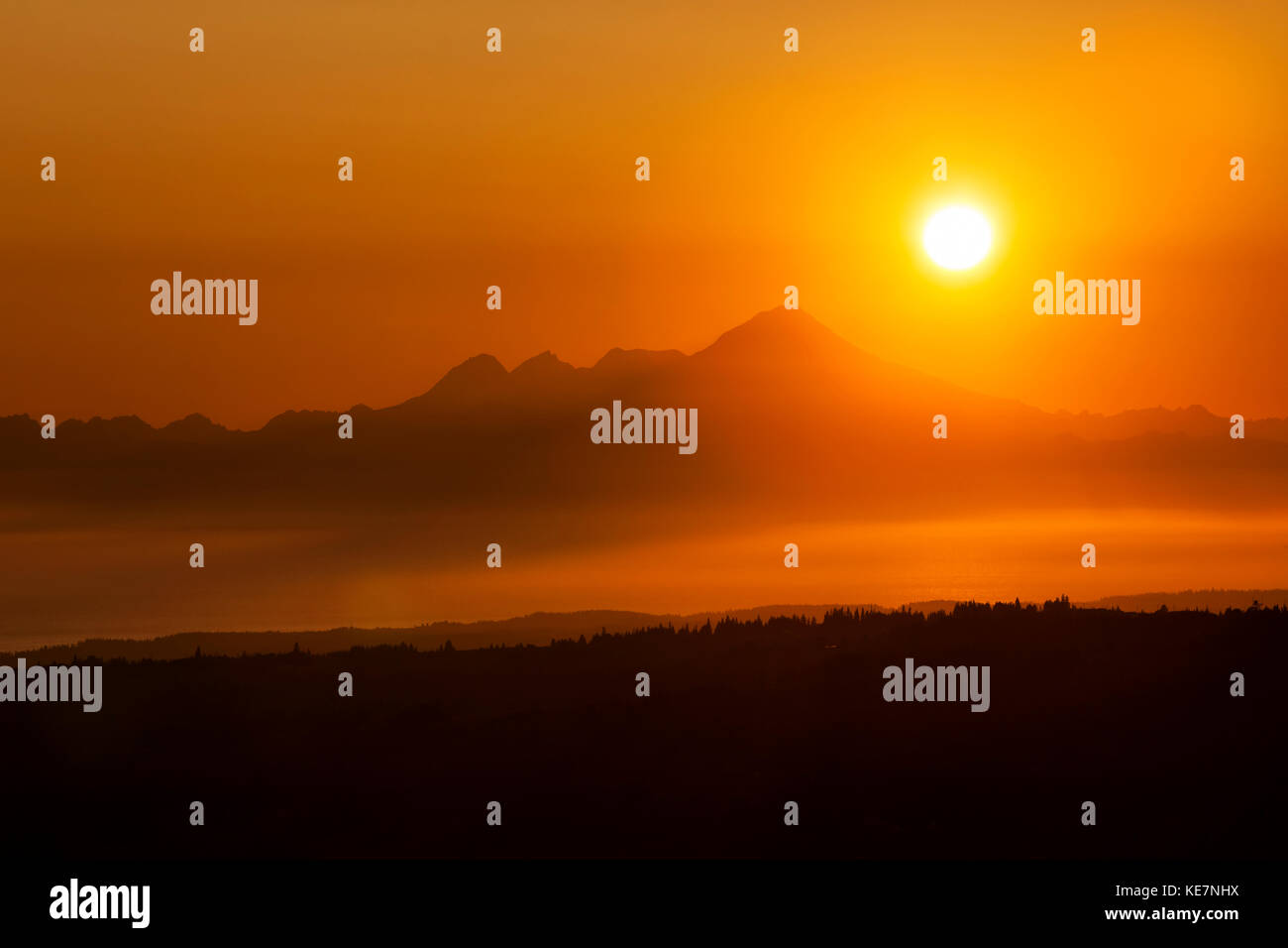 Glowing Sun During A Golden And Orange Sunset Over Kenai Mountains ...