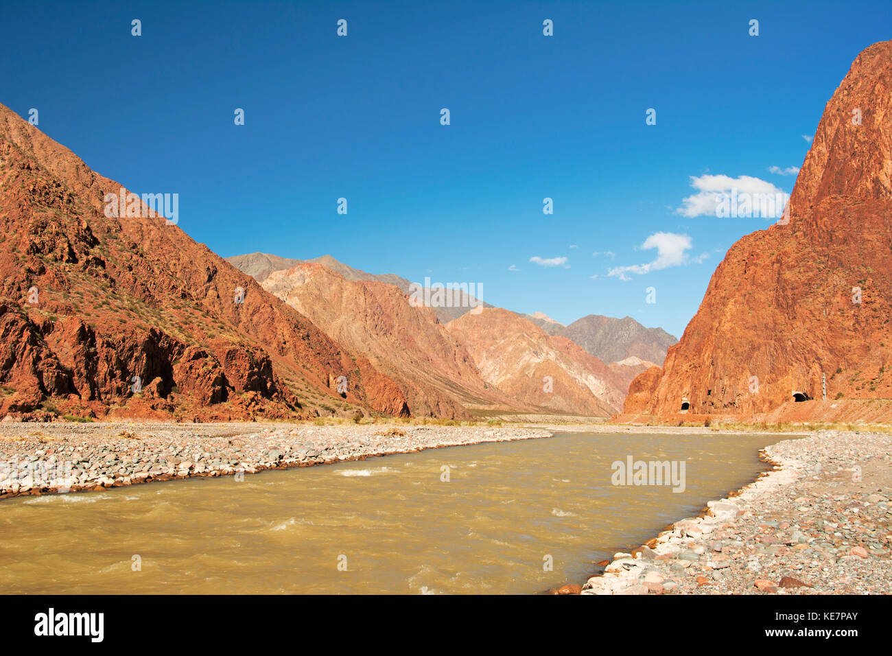 A River Snakes Through Colourful Mountains In The Dry Andes, Two Road ...