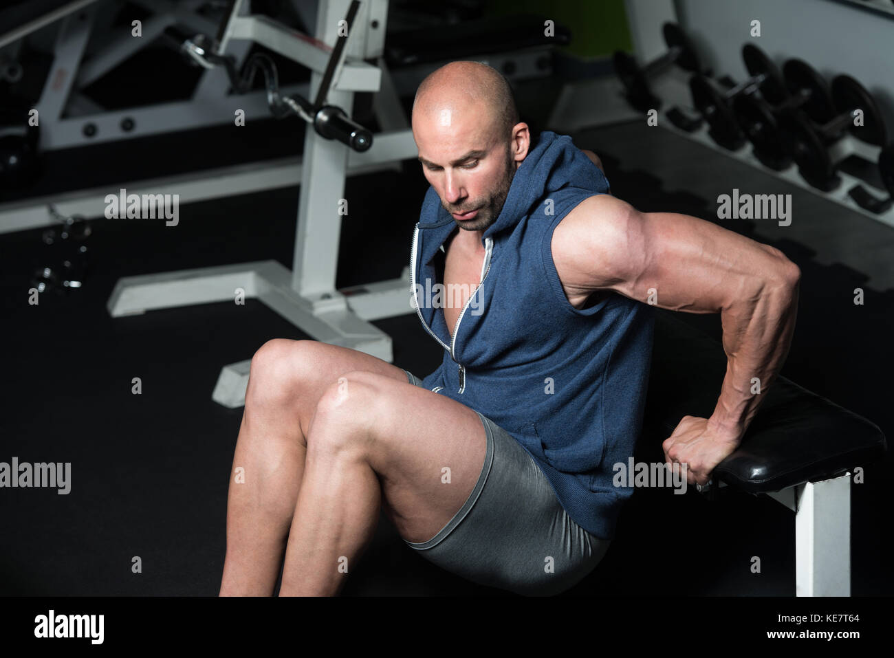 Strong Man In The Gym Exercising Triceps On Bench - Muscular Athletic ...