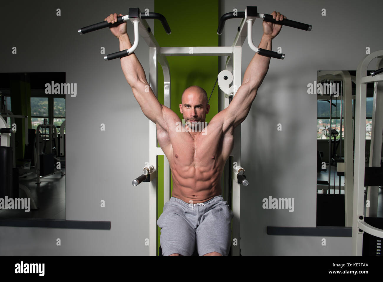 Man Performing Hanging Leg Raises Exercise - One Of The Most Effective ...