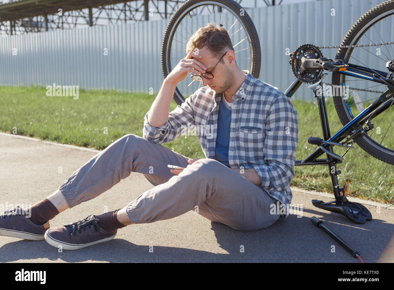 A puzzled man searches the internet for the cause of a bicycle ...